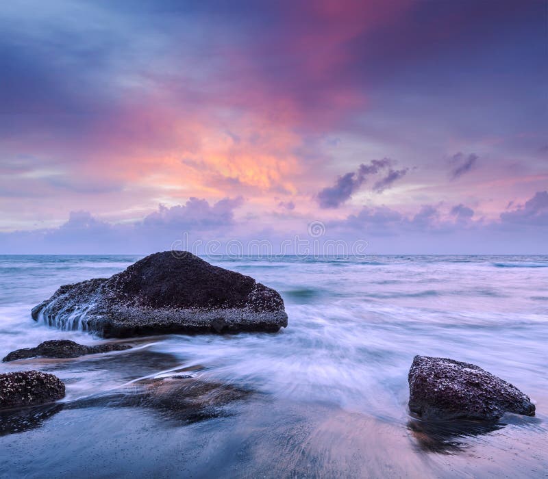 Waves and Rocks on Beach of Sunset Stock Image - Image of dusk ...