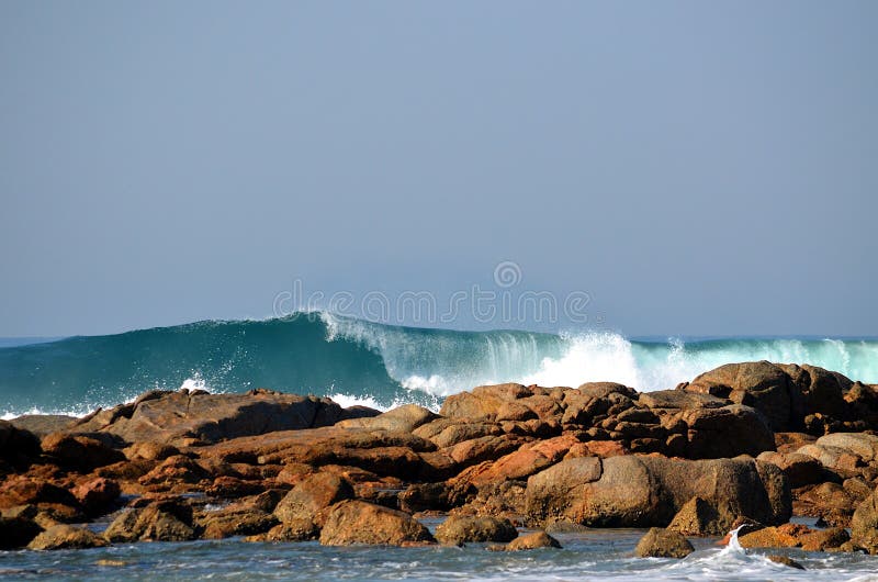 Waves and rocks stock photo. Image of waves, rocks, beach - 228354496