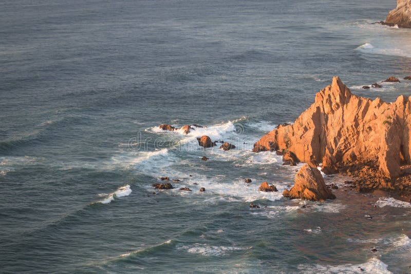 Waves and Rocks in Rays of Setting Sun on Cabo Da Roca, Portugal Stock ...