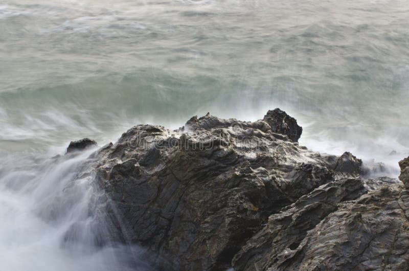 Waves on rocks stock photo. Image of scene, beautiful - 51279542