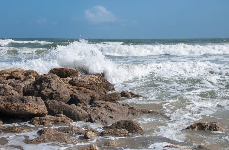 Rocky beach with waves stock image. Image of water, sunny - 29840519