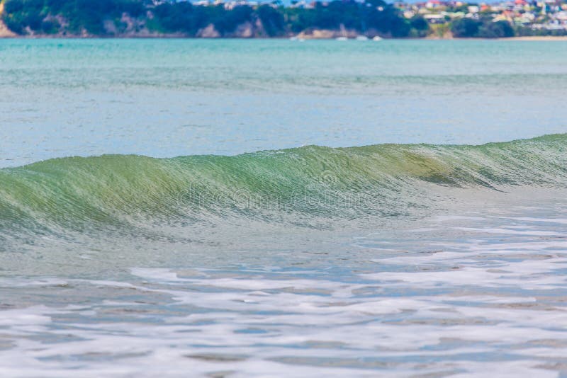 Waves roll into the beach stock photo. Image of small - 126918356