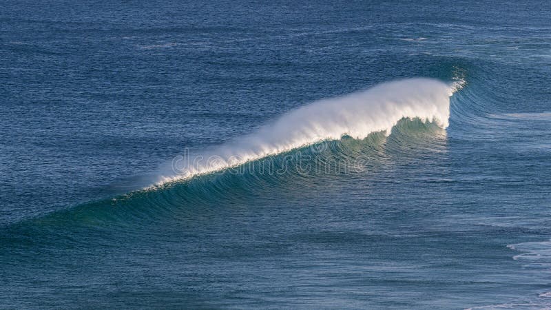 Waves Roll Over the Shore and Create a Wave Breaking into the Ocean Stock Image - Image of ...