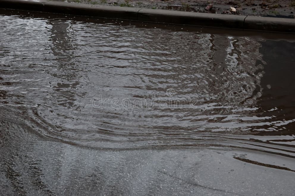 Waves Run in a Deep, Dark Puddle Stock Image - Image of gothic, urban ...