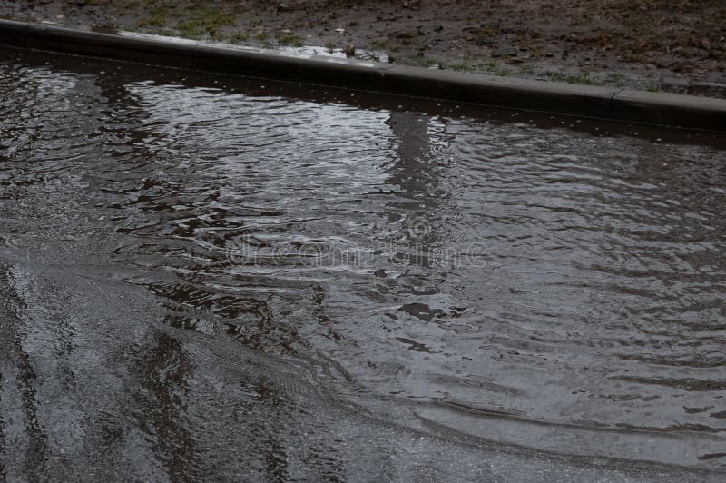 Waves Run in a Deep, Dark Puddle Stock Photo - Image of weather ...