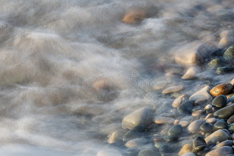 Waves Rushing Over Stones on a Lake Huron Beach Stock Image - Image of ...