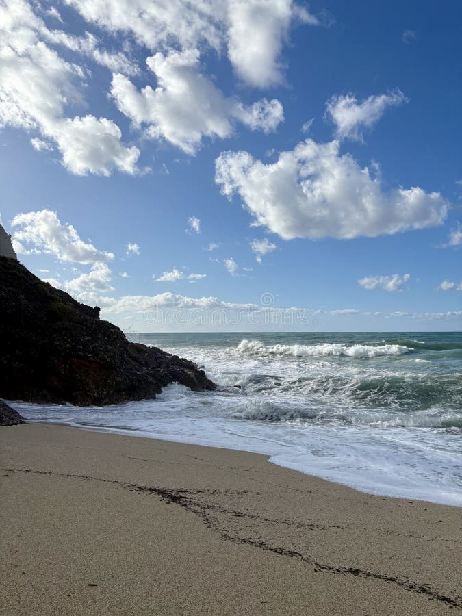 Sea waves and sandy beach stock photo. Image of clear - 146973152