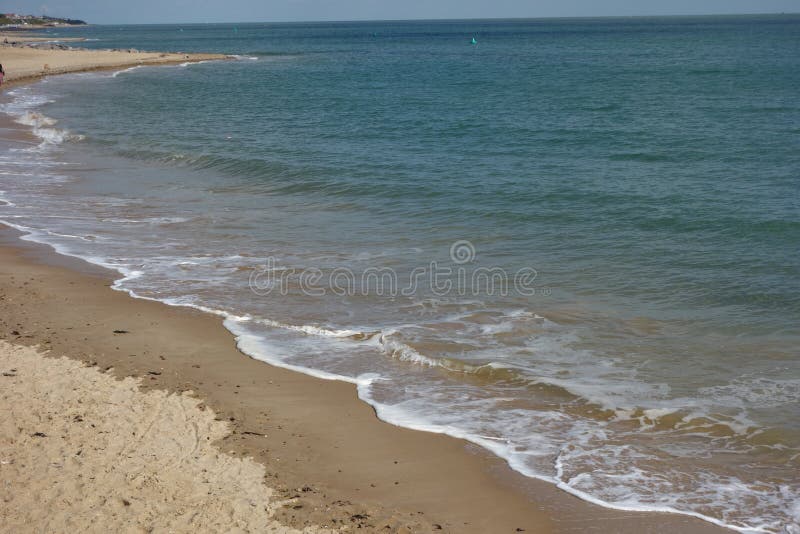 Waves on a Sandy Beach stock image. Image of summer - 158789789