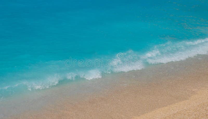 Waves on sandy beach stock photo. Image of summer, coast - 240271158