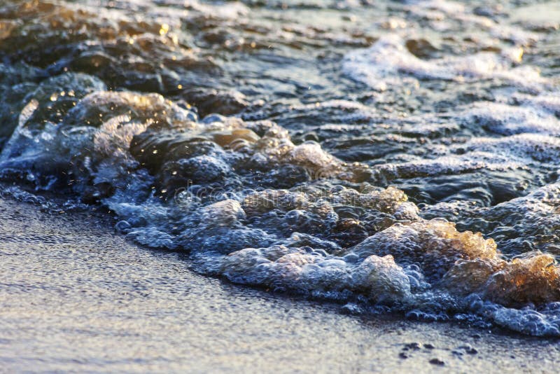 Waves on the Sandy Shore of a Large River. the Rays of Light are ...