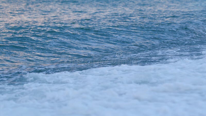 Waves in Sea Under Cloudless Sky during Sunset. Sunset on Dark Sea ...