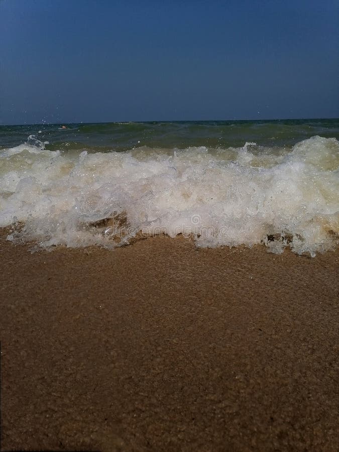 The Waves Splash Beautifully on the Sea Sandy Shore. White Foam from ...