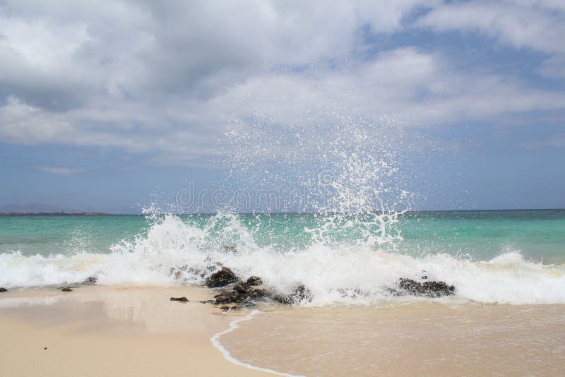 Waves splashing on beach stock photo. Image of coast - 90154970