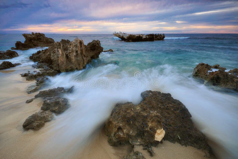 Waves Splashing Onto the Rock Stock Photo - Image of square, dusk: 29506508