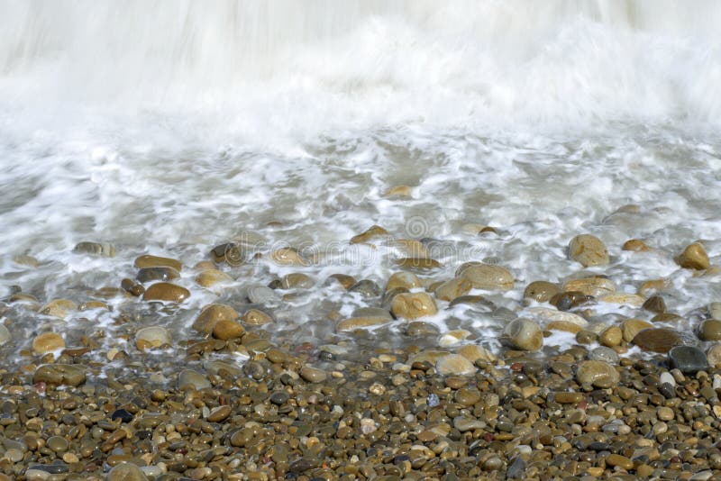 Waves on stone beach. stock image. Image of bright, ocean - 94973341