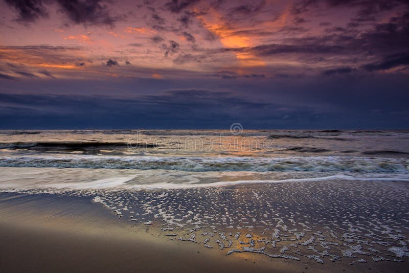 Waves and sunset stock photo. Image of cloudy, color - 198158192