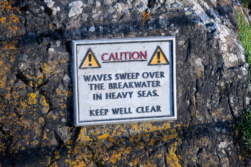Waves Sweep Over the Breakwater Warning Sign Stock Image - Image of ...