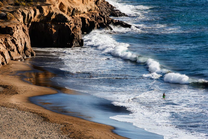 Waves in Taurito beach stock image. Image of warm, rocks - 180988461