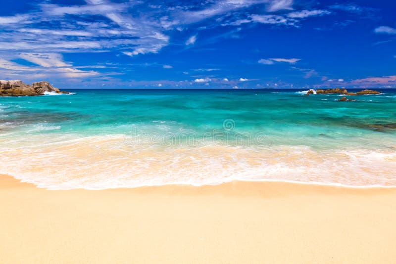 Waves on tropical beach stock image. Image of vacations - 207089025