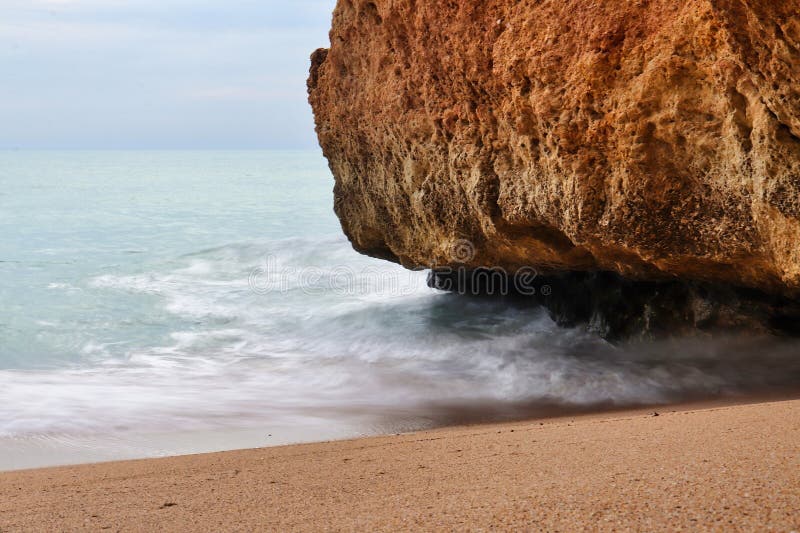 Waves Under a Cliff on a Portuguese Beach Stock Image - Image of cave ...