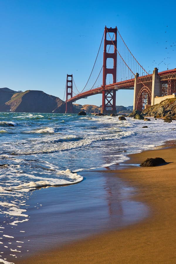 Waves on Wet Sandy Beach Below Golden Gate Bridge Stock Photo - Image ...