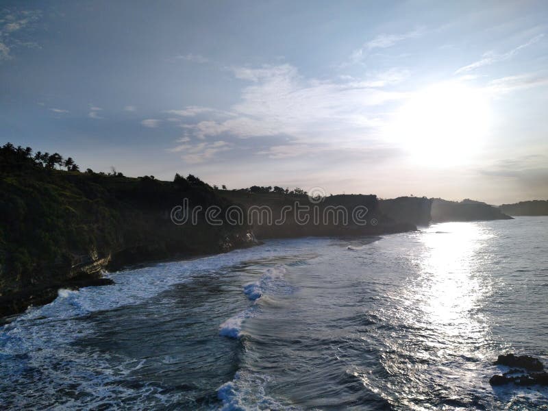 Wavey beach at sunrise stock image. Image of beach, shore - 244665775