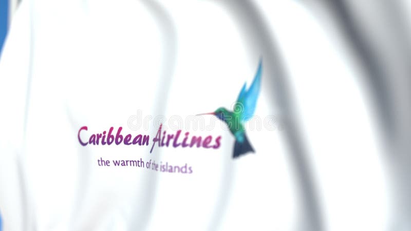 Waving Flag with Caribbean Airlines Logo, Close-up. Editorial Loopable ...