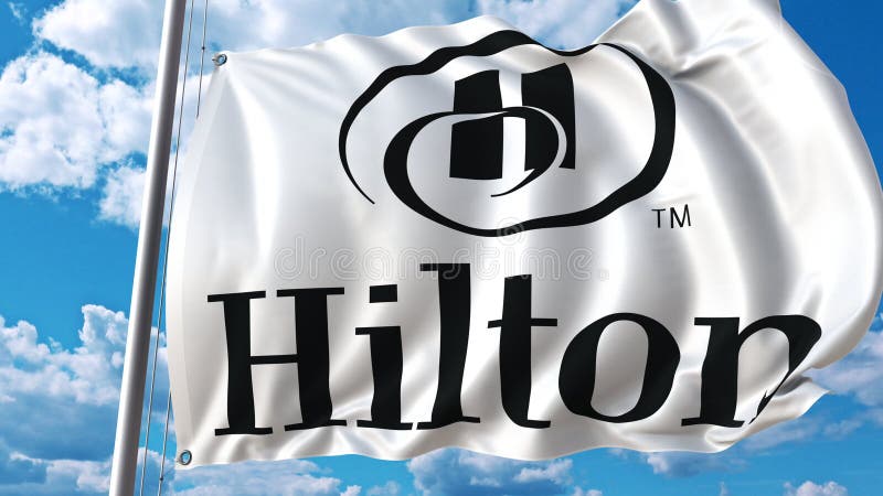 Waving Flag with Hilton Logo Against Sky and Clouds. Editorial 3D ...