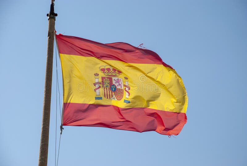 Flag of Spain on a pole stock image. Image of waving - 135930857