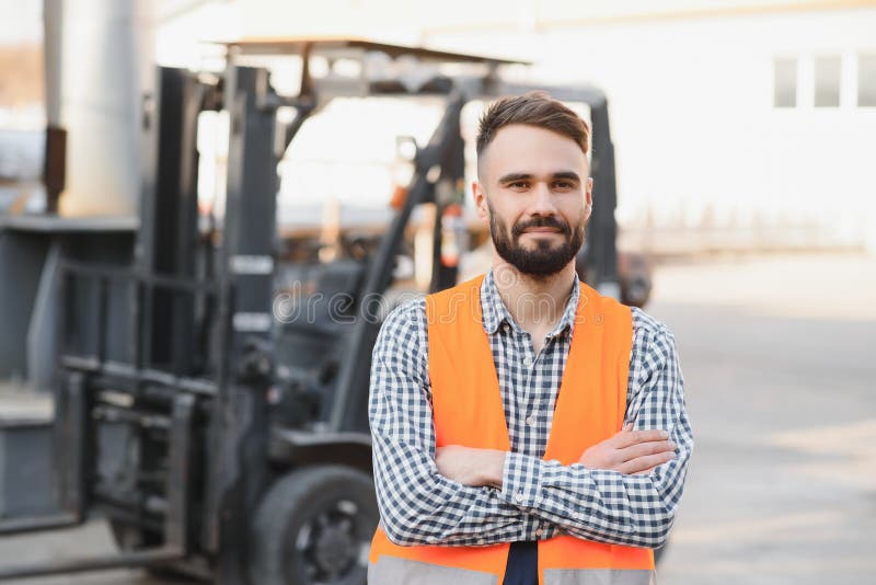 Waving Forklift Driver in the Warehouse of a Haulage Company while ...