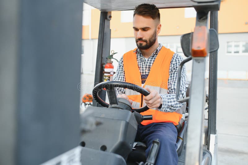 Waving Forklift Driver in the Warehouse of a Haulage Company while ...
