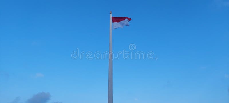 Waving the Red and White Flag Under the Blue Sky Stock Photo - Image of ...