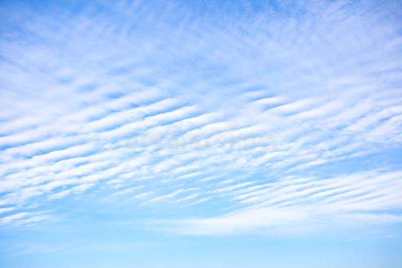 Wavy clouds in blue sky stock photo. Image of clouds - 228463780
