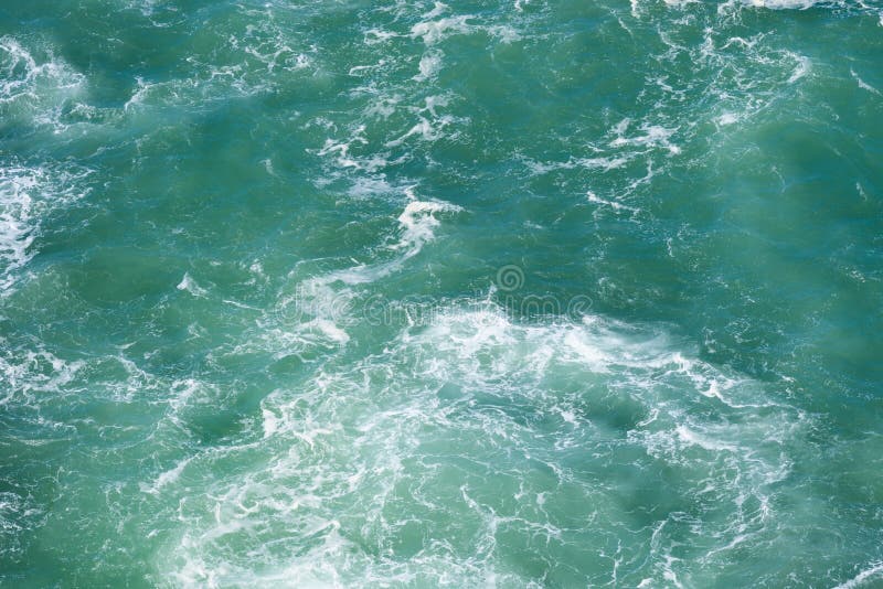 Wavy emerald ocean surface stock photo. Image of surface - 240885160