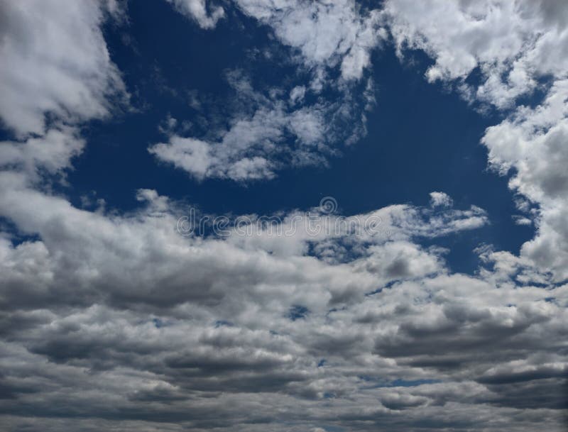 Wavy Gray and White Clouds. the Dark Blue Sky Inside. Stock Photo ...