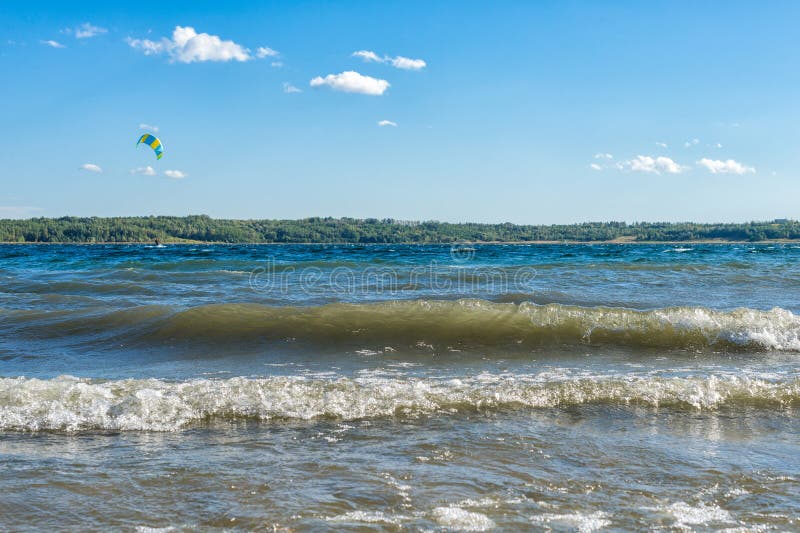 Wavy Lake with a Lonely Kiteboarder Flying Over the Water Stock Image ...