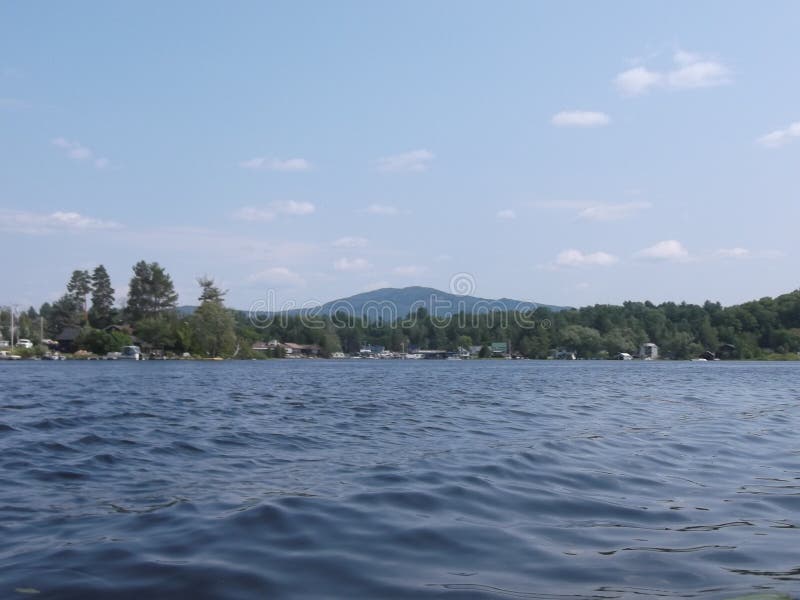 Wavy lake stock image. Image of mountains, lake, boats - 57235059