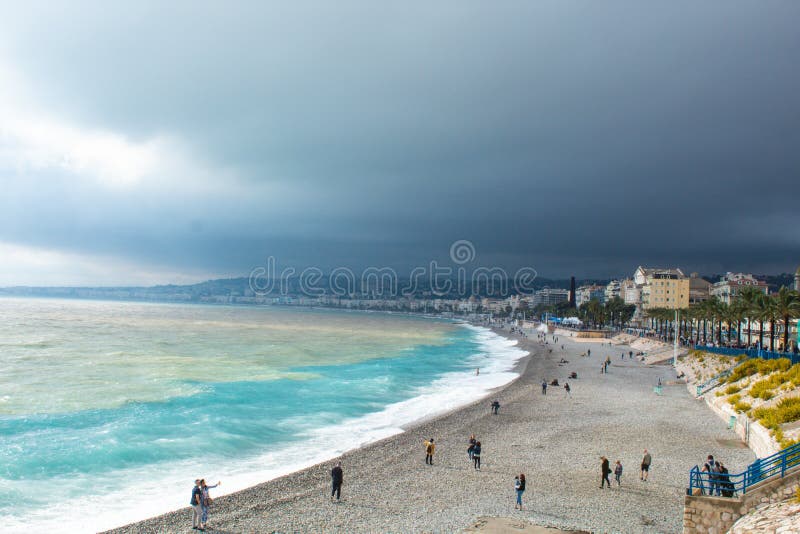 Wavy Ocean Hitting the Sandy Beach in Nice, France Stock Photo - Image ...