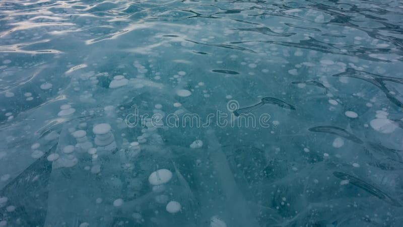 The Wavy Surface of Turquoise Ice. Close-up. Full-screen Stock Image ...