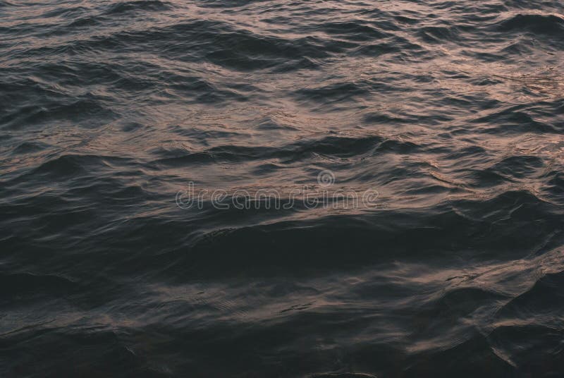 Wavy Water in the Sea with a Sunset Reflection Stock Photo - Image of ...