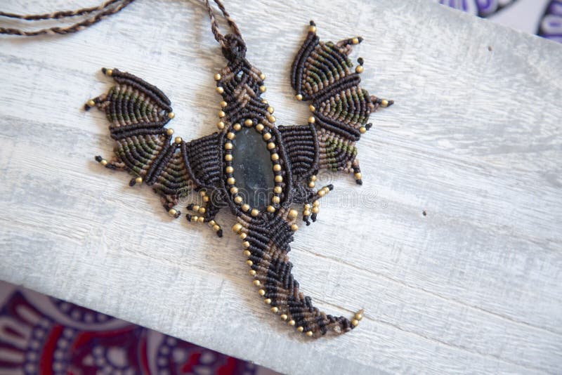 Waxed String Necklace with Gemstone in the Shape of Dragon Stock Photo - Image of design, shape ...