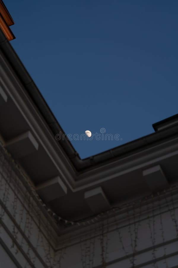 The Waxing Moon. the Moon is on the Corner of the Building. Minimalism ...