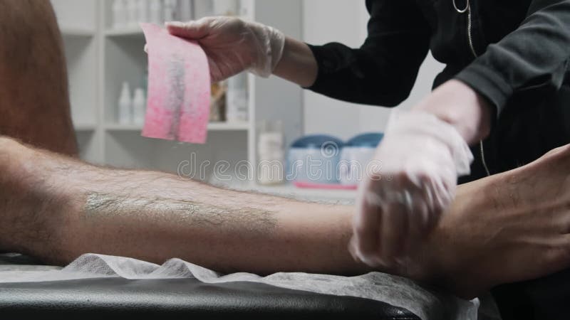 Waxing Procedure - the Master Using Strips for Depilating Hairs Off Her ...