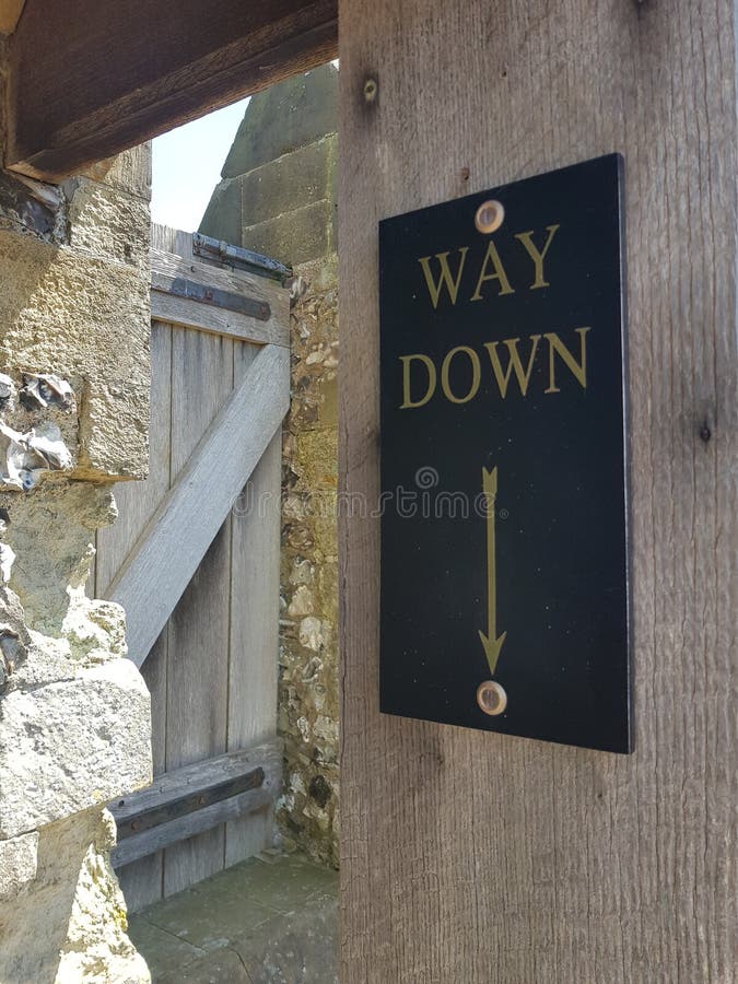 Way down sign above steps. stock image. Image of decent - 119514449