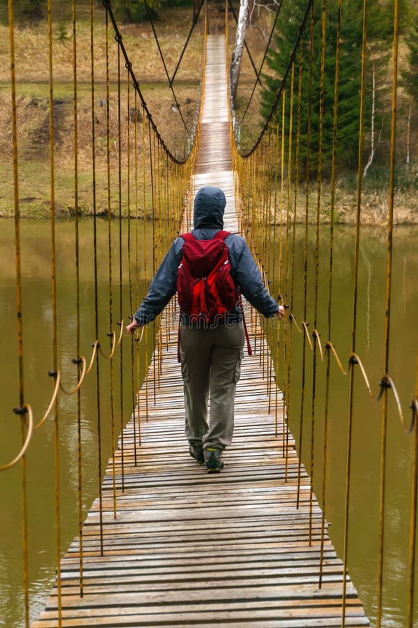 Woman Traveler Takes a Picture from a Suspension Bridge Over the Spring ...