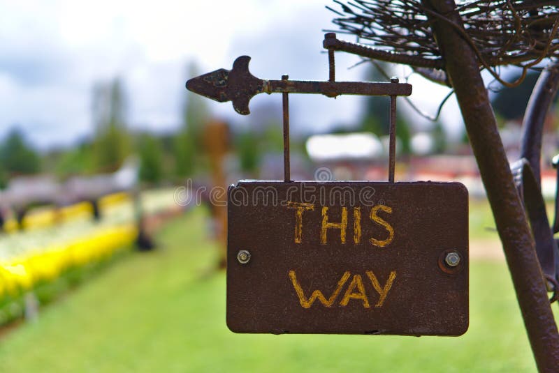 This Way Sign Made Out of Old Corrosive Brass Stock Photo - Image of ...