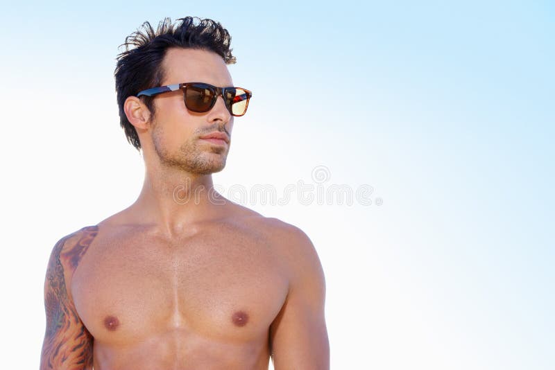 Way Too Cool. Head and Shoulders Shot of a Handsome Tattooed Young Man ...