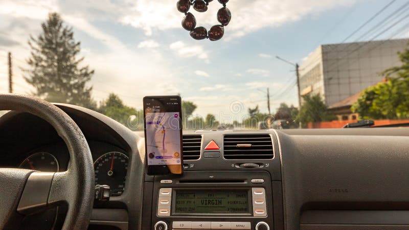 Waze Maps Showing the Way Thru the City. Driver Using Waze Maps ...