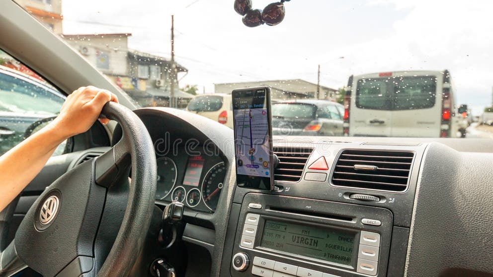 Waze Maps Showing the Way Thru the City. Driver Using Waze Maps ...