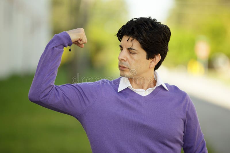 Weak Man Flexing His Muscles Royalty Free Stock Image - Image: 35217386